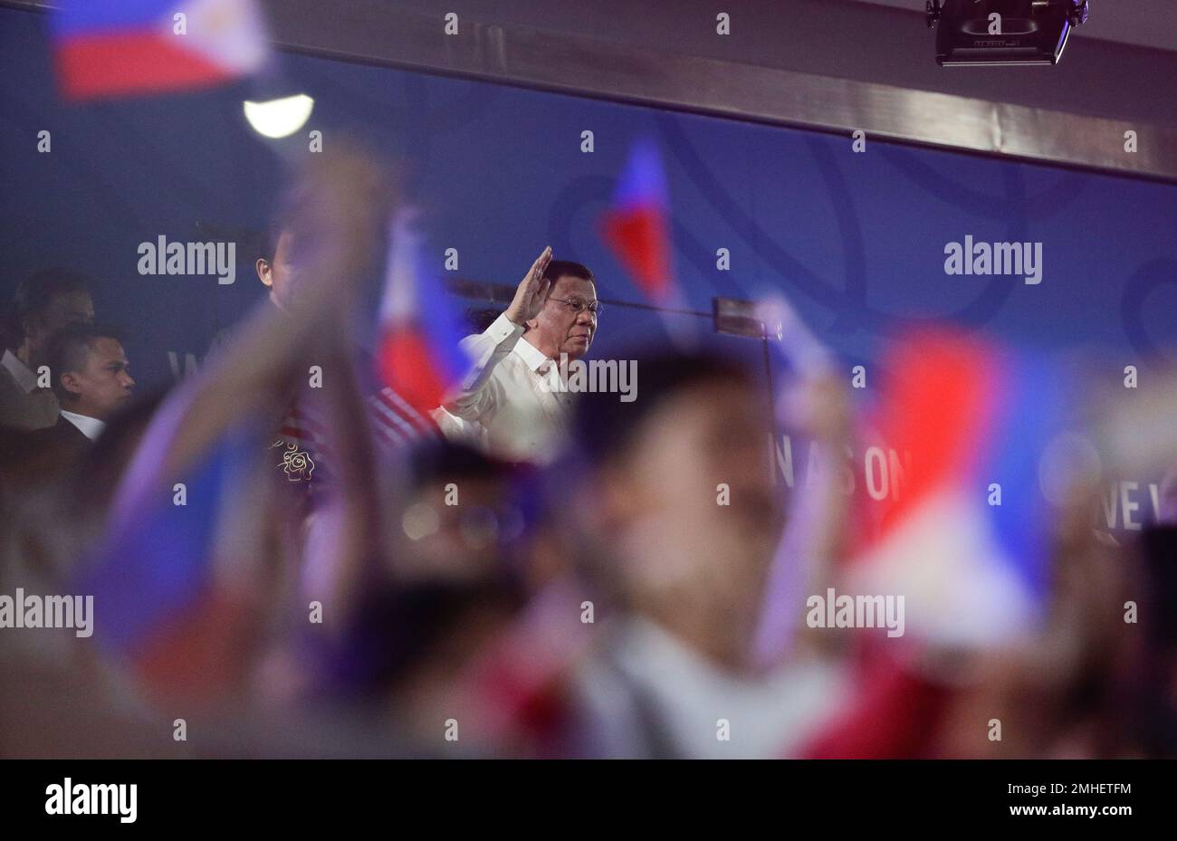 Philippine President Rodrigo Duterte waves as he attends the opening ...