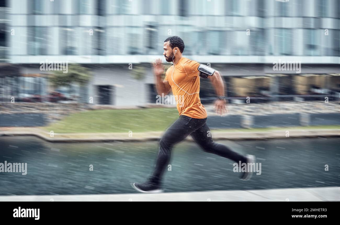 Blurred, fitness and man running as exercise in the city training ...