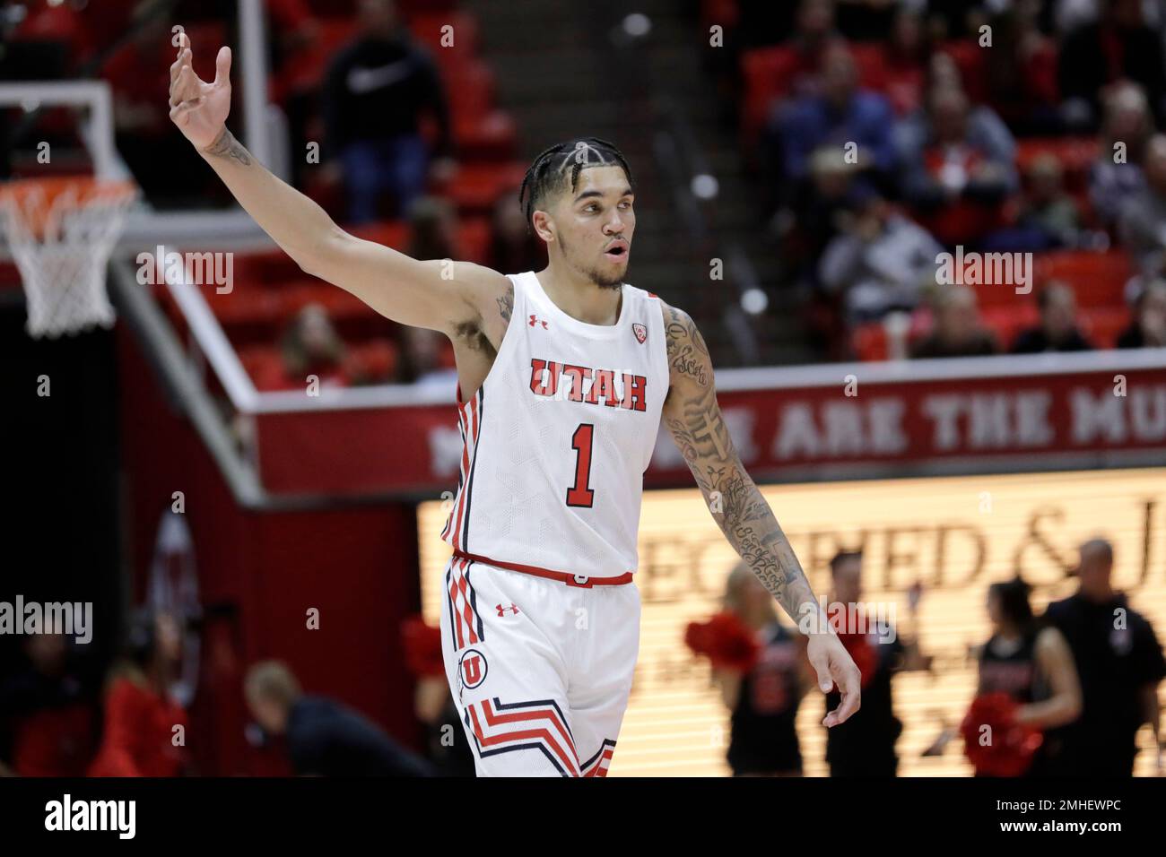 Utah forward Timmy Allen (1) celebrates as he walks up the court during ...
