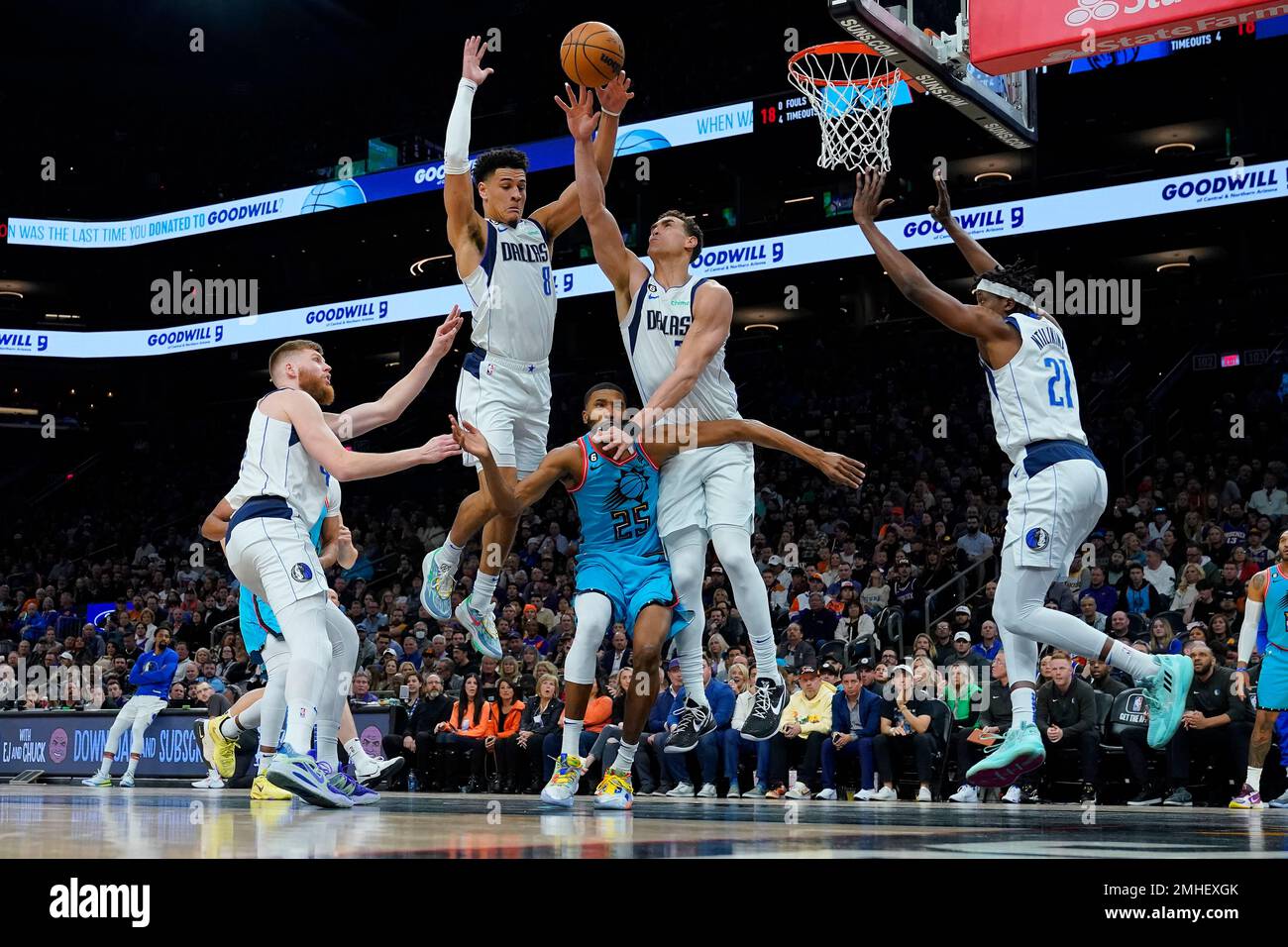 Phoenix Suns forward Mikal Bridges (25) tries to shoot as Dallas Mavericks guard Josh Green (8 ...