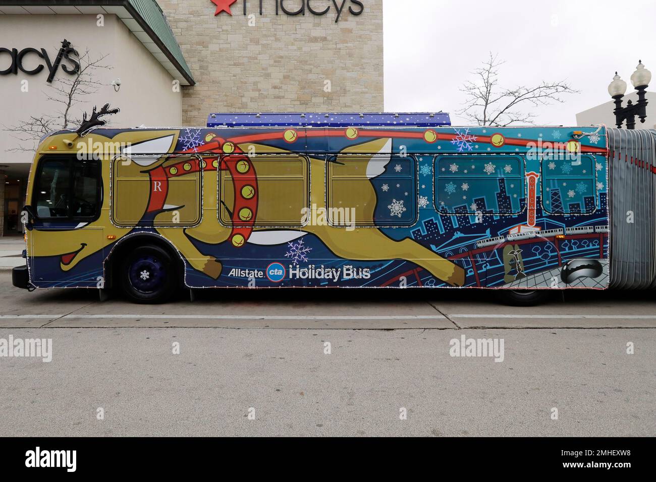 This photo shows an exterior view of a CTA Holiday bus at a bus stop in ...