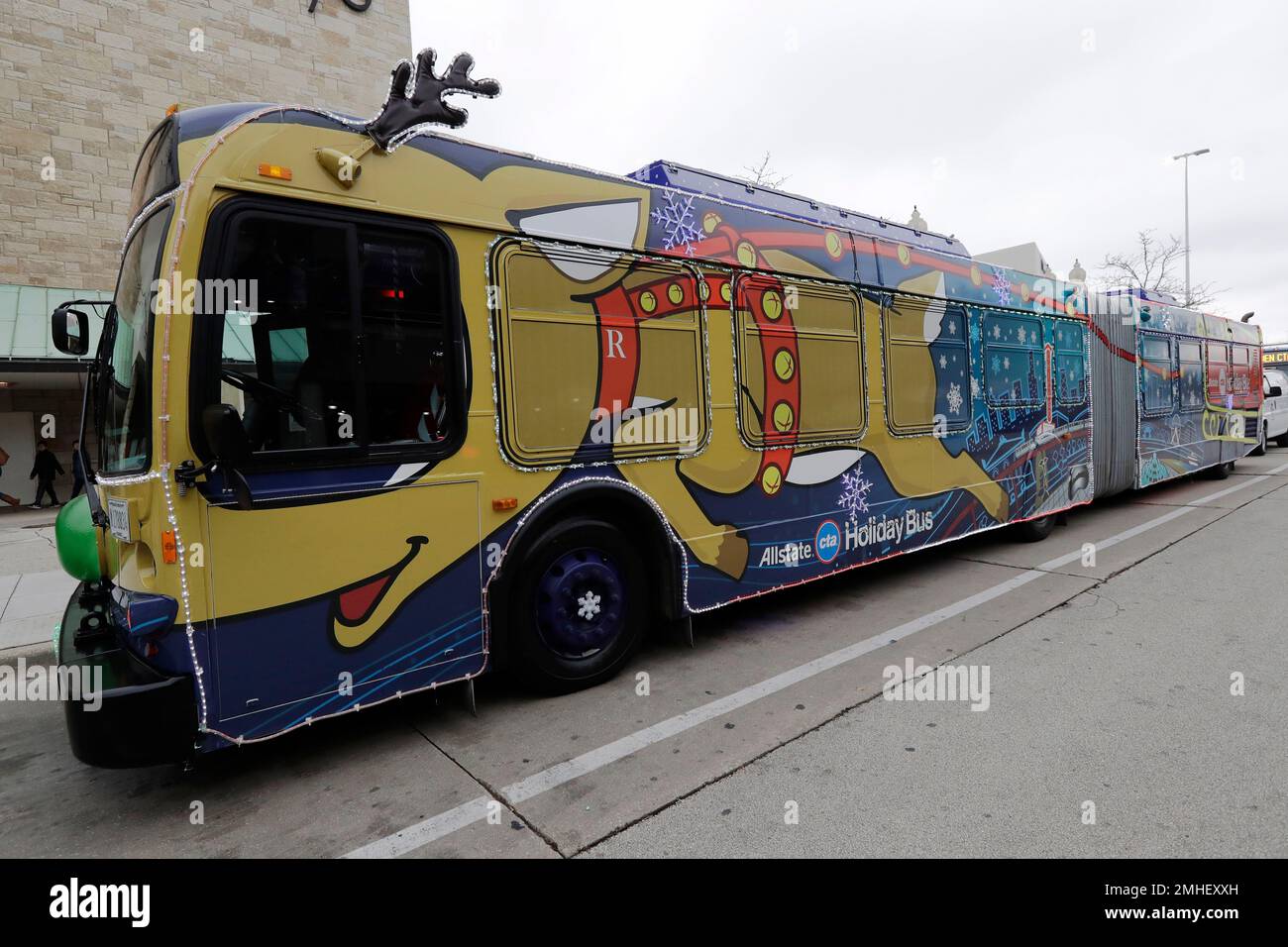 This photo shows an exterior view of a CTA Holiday bus at a bus stop in ...