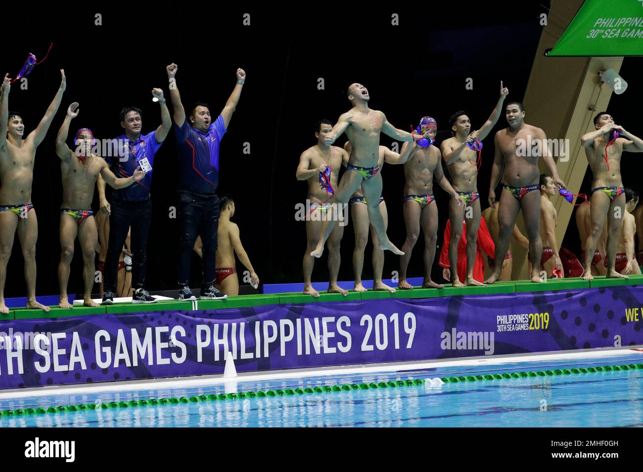 Philippines' water polo team jubilate after their game against ...