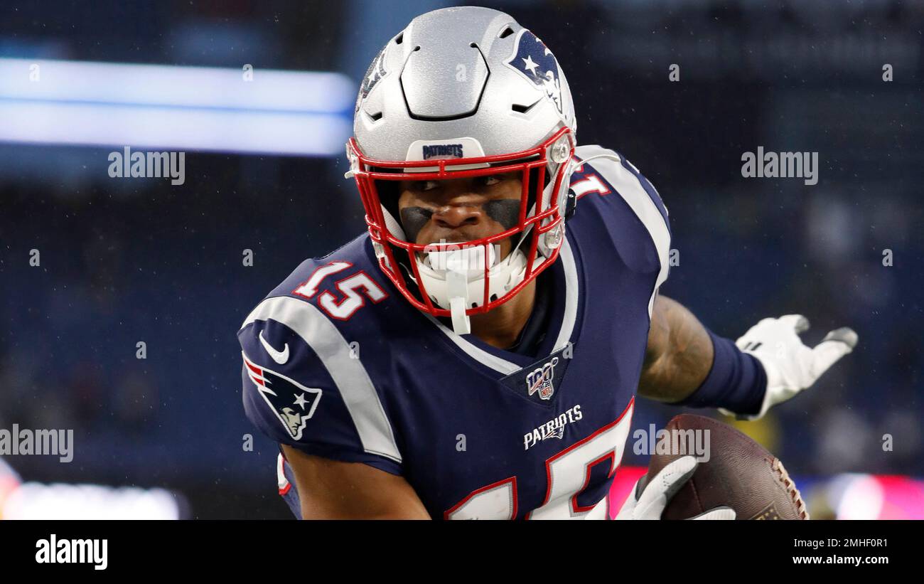 New England Patriots' N'Keal Harry runs with the ball after catching a ...