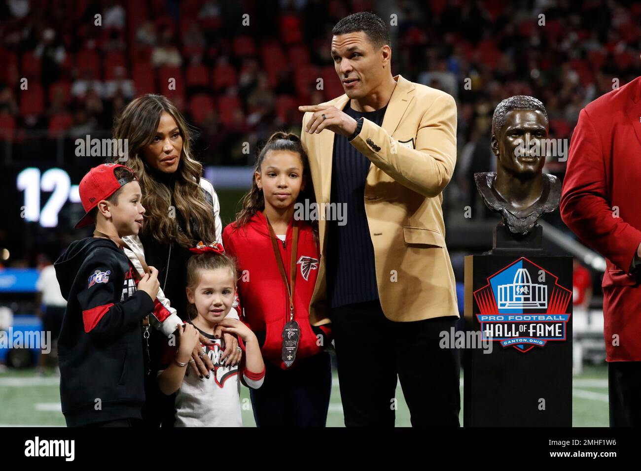 Former NFL player and Football Hall of Fame member Tony Gonzalez stands ...
