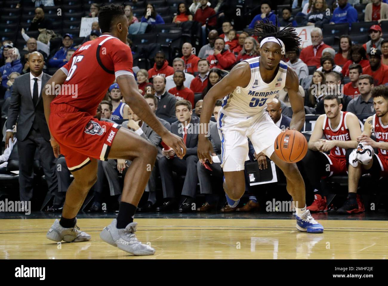 Memphis' Precious Achiuwa (55) drives past North Carolina State's Manny ...