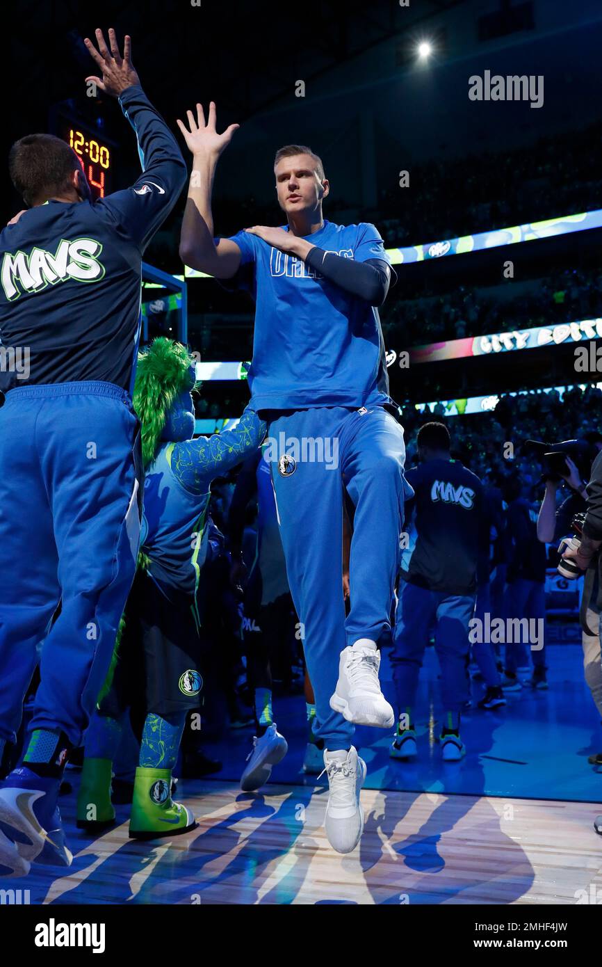 Dallas Mavericks' J.J. Barea, left, and Kristaps Porzingis, right ...