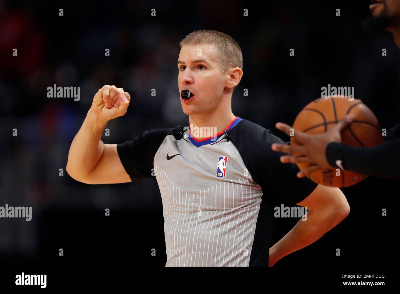 Referee Tyler Ford signals during the second half of an NBA basketball ...