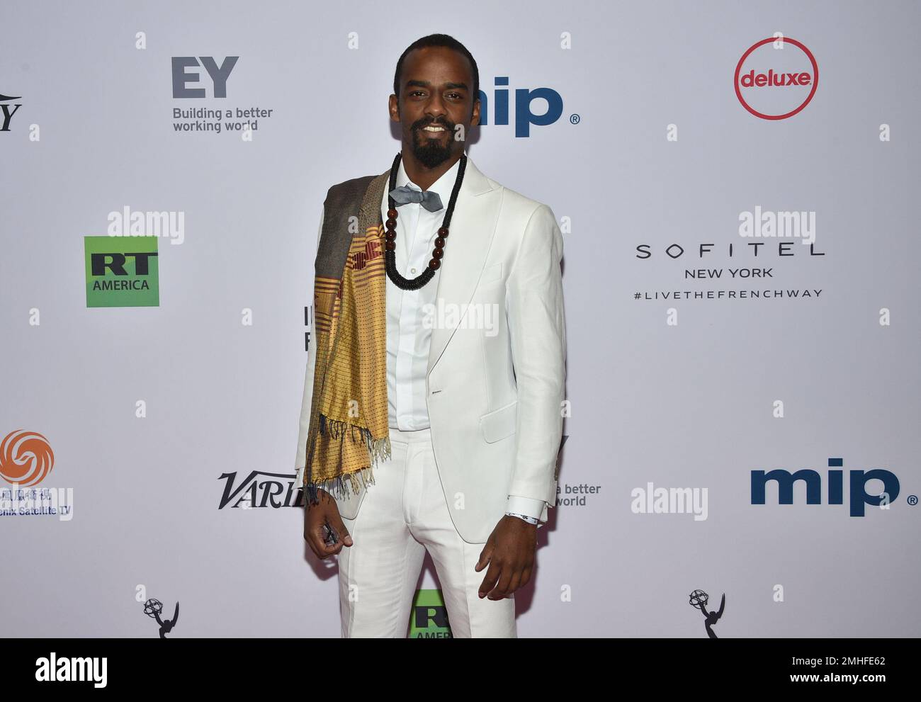 Raphael Logam arrives at the 47th International Emmy Awards gala at the ...