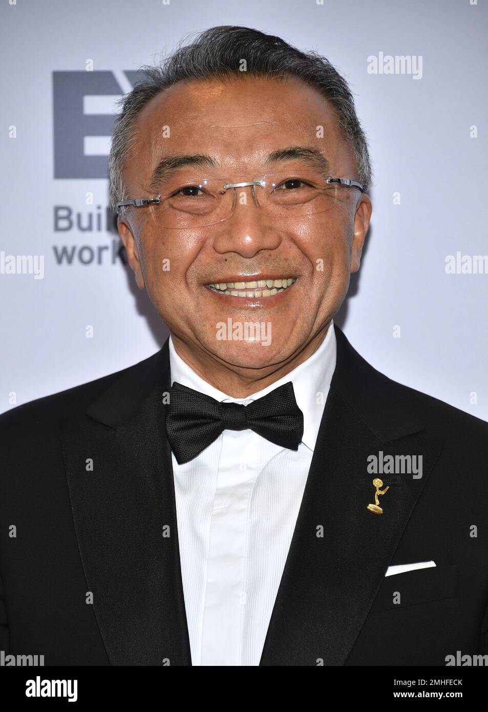 Nelson Sato arrives at the 47th International Emmy Awards gala at the ...