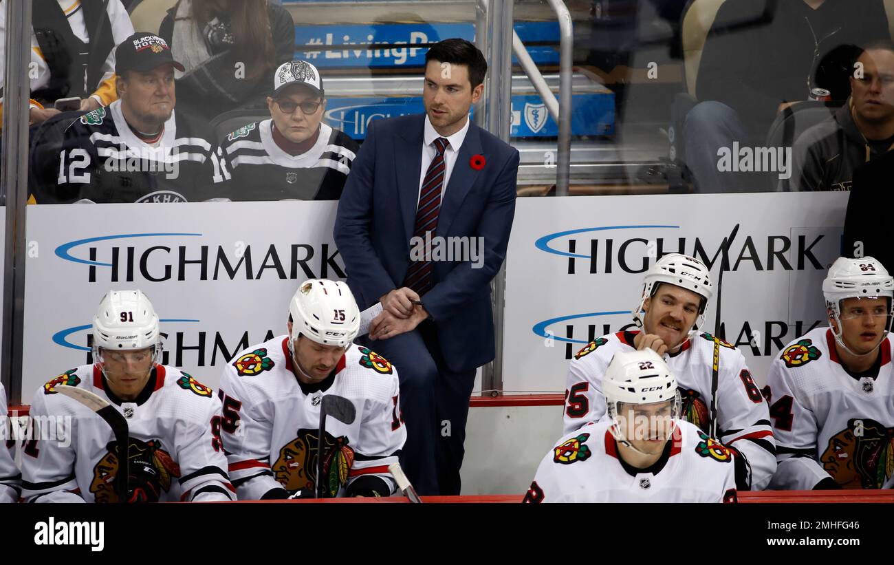 Chicago Blackhawks head coach Jeremy Colliton stands behind his bench ...