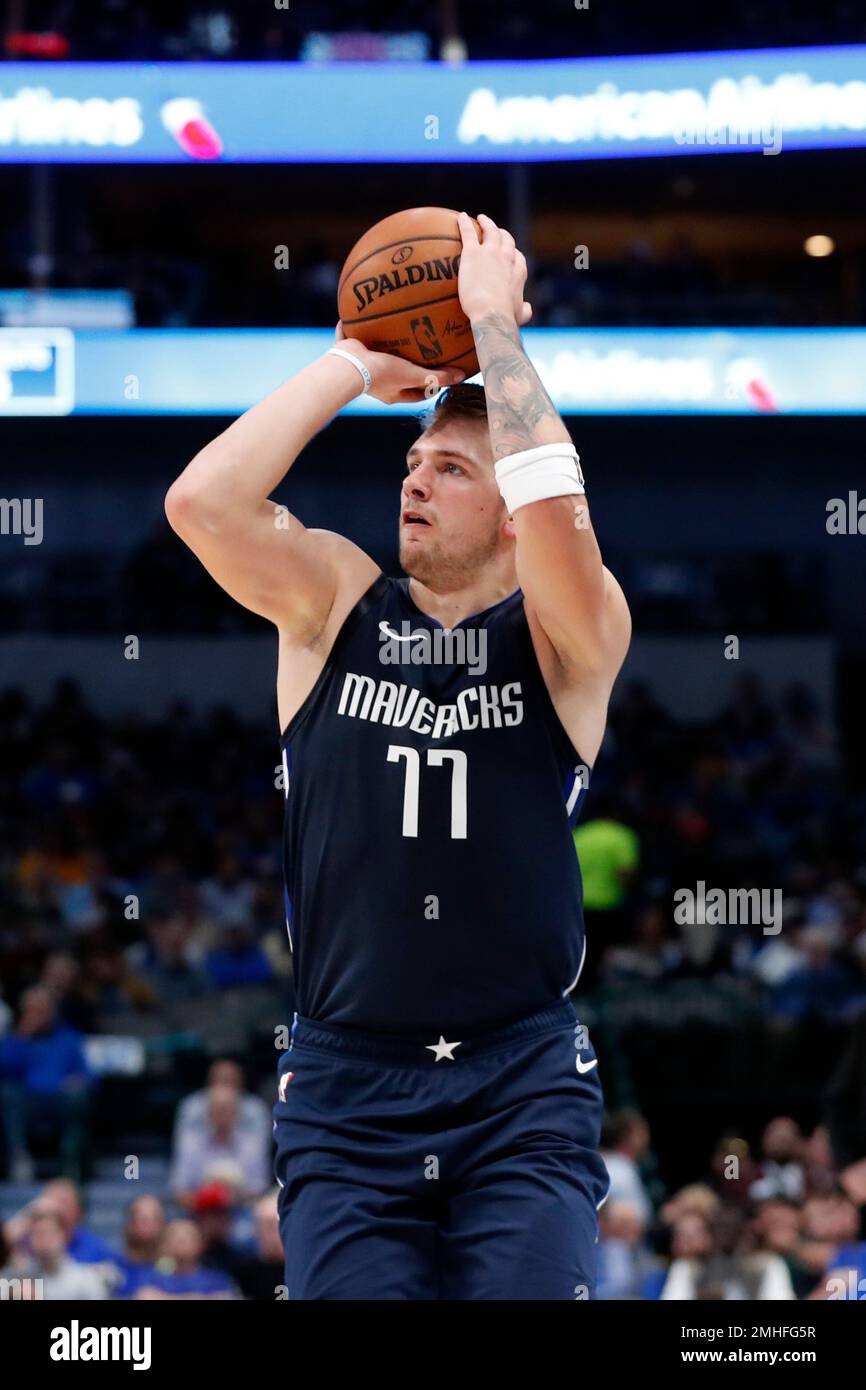 Dallas Mavericks forward Luka Doncic (77) goes up for a shot during an ...