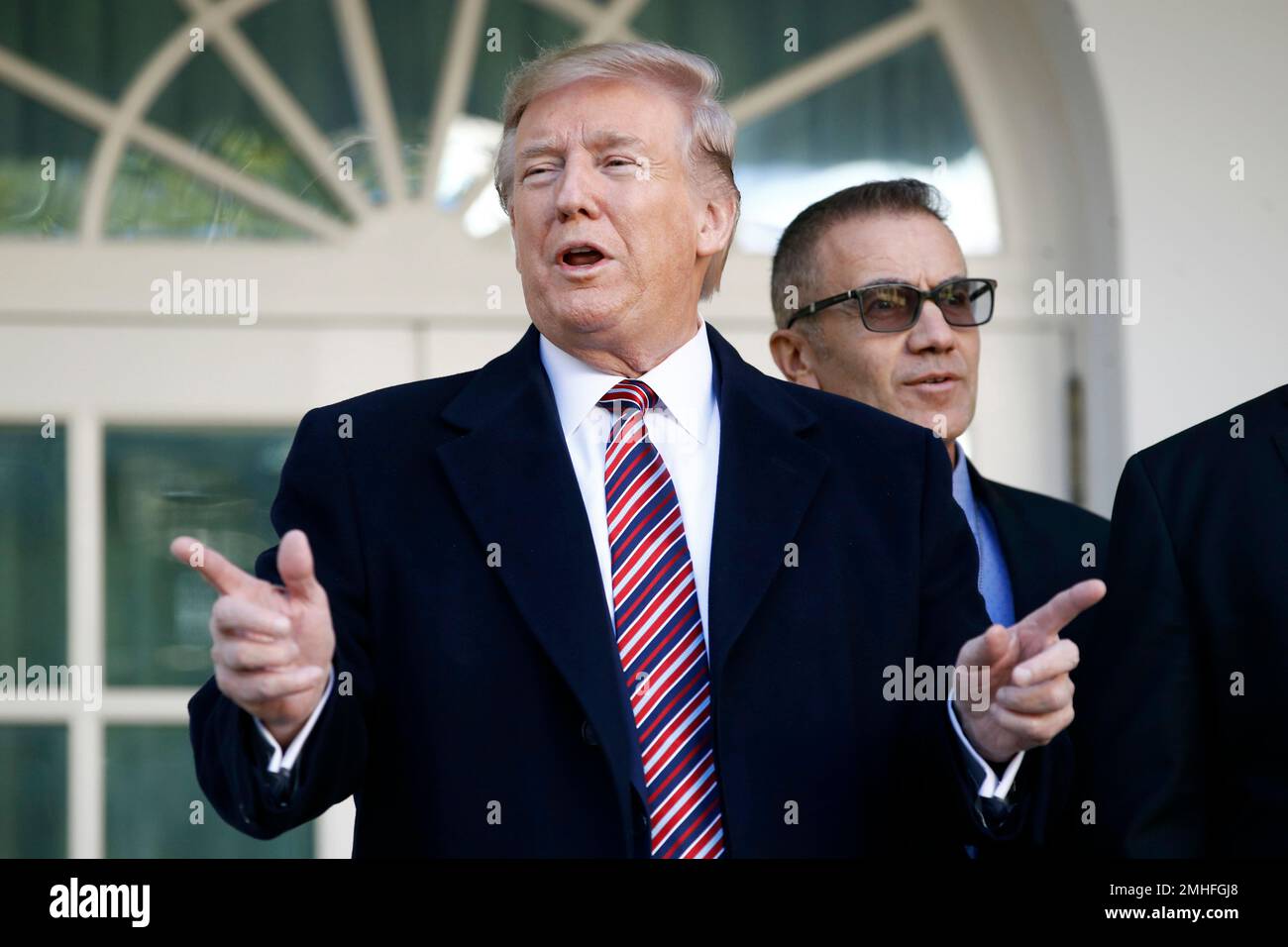 President Donald Trump speaks with members of the press in the Rose ...