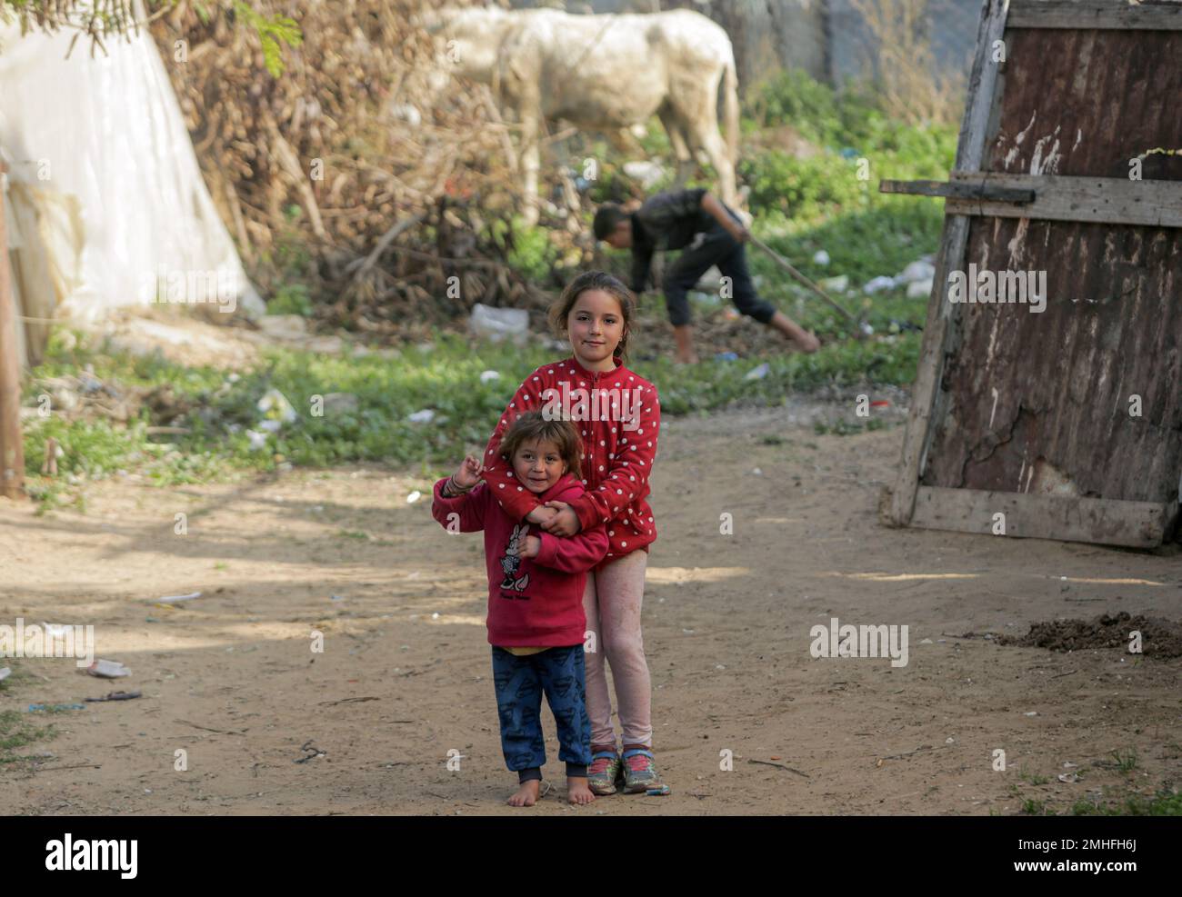Gaza, Palestine. 25th Jan, 2023. Palestinian girls play in front of ...