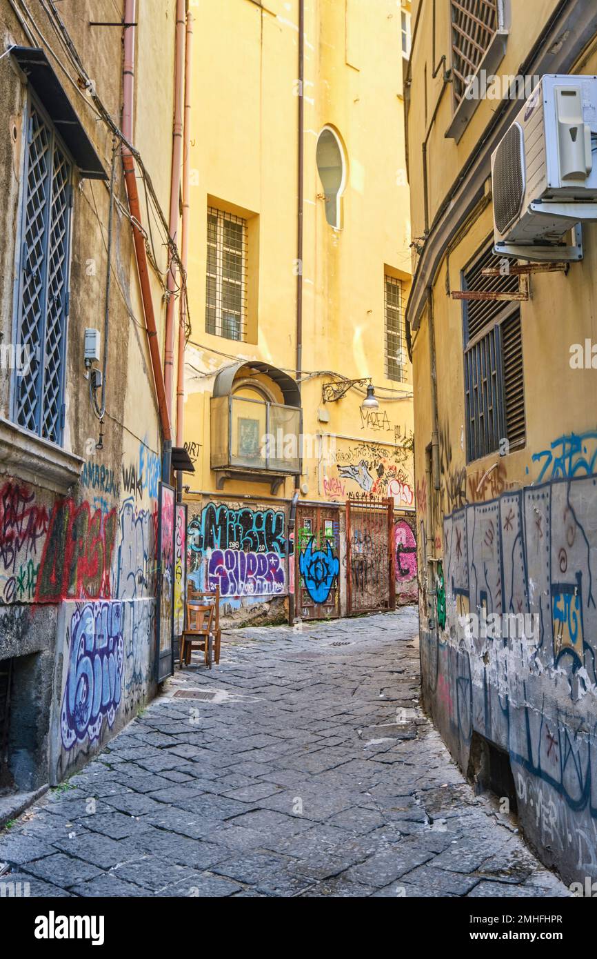 A small, curving alley in the Centro Historico neighborhood, walls ...