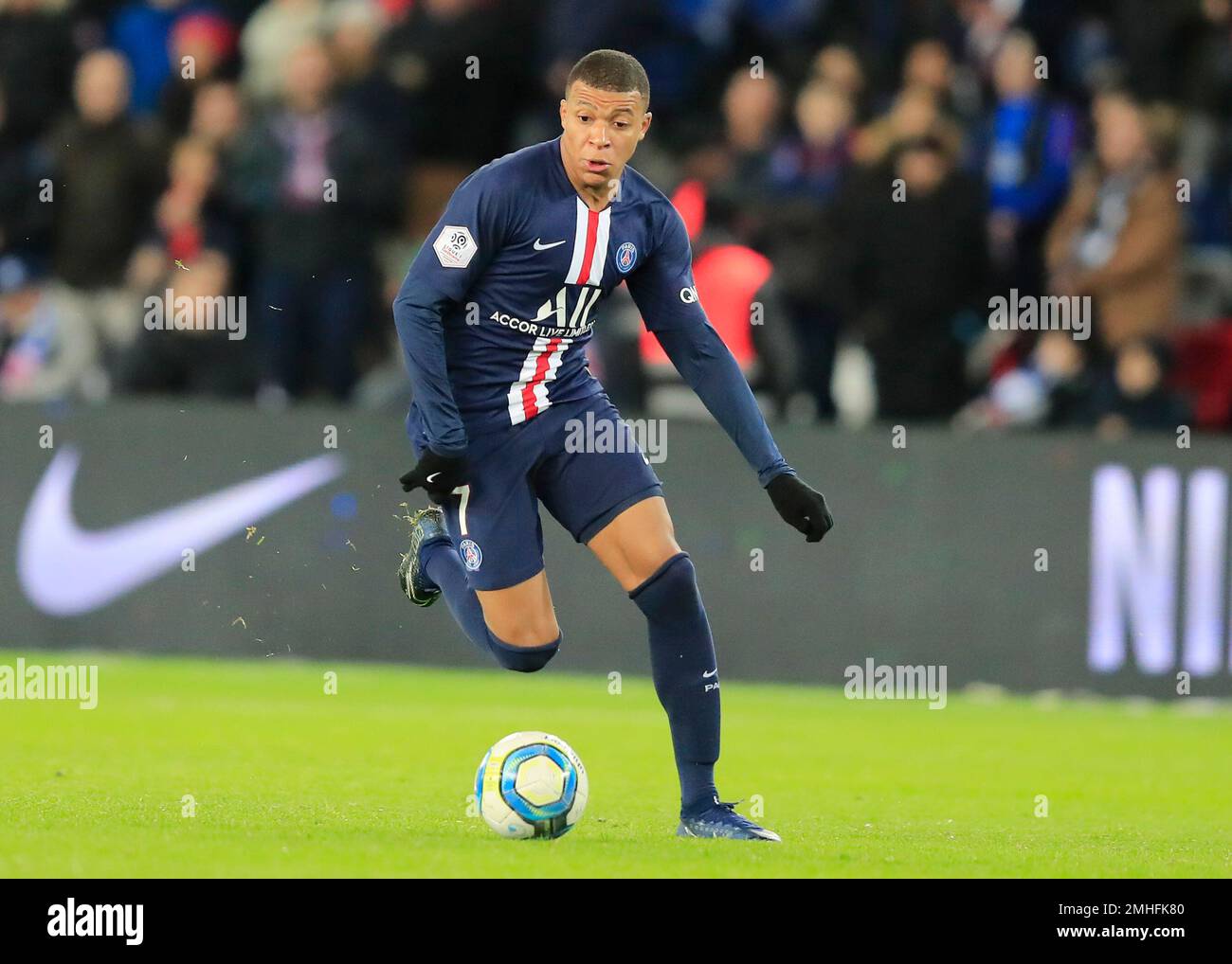 PSG Kylian Mbappe controls the ball during a French League One soccer ...
