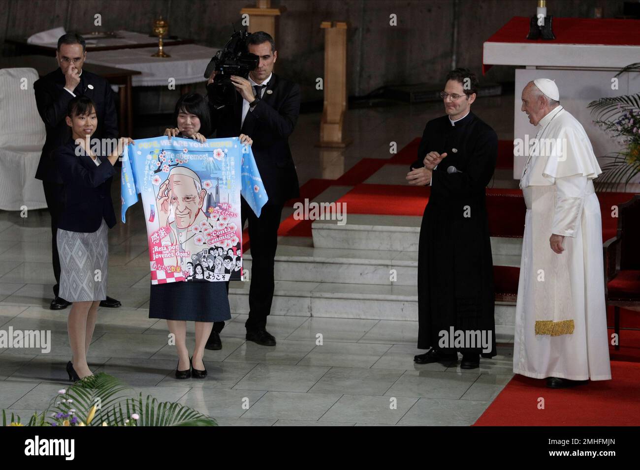 A young participants present Pope Francis with a traditional Japanese ...