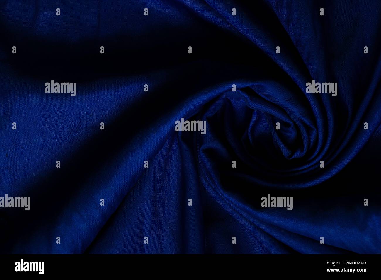 blue plain silk pleated fabric as background Stock Photo - Alamy