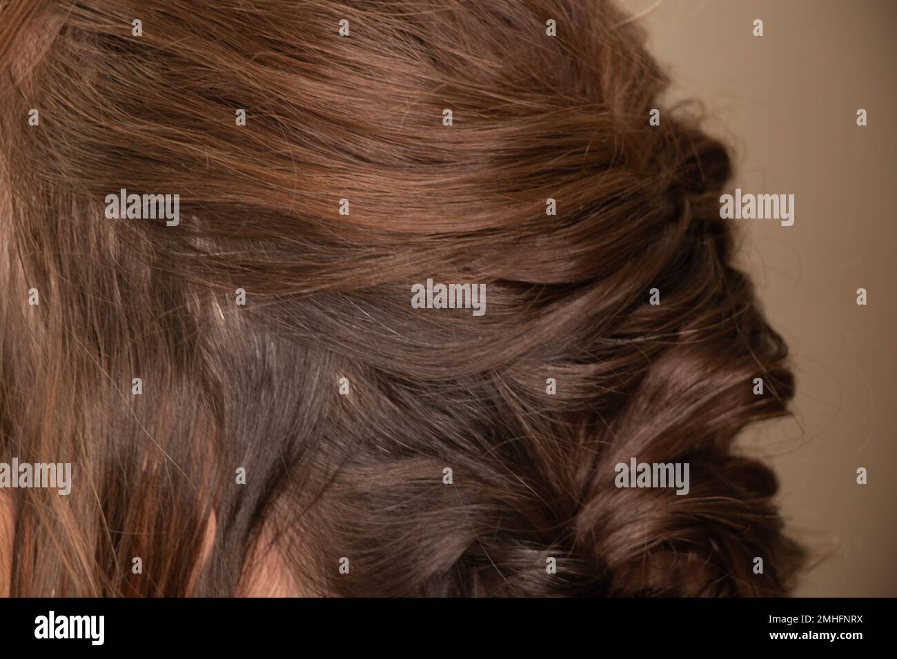 Woman with creative hairstyle from braids, close-up photo, braiding ...
