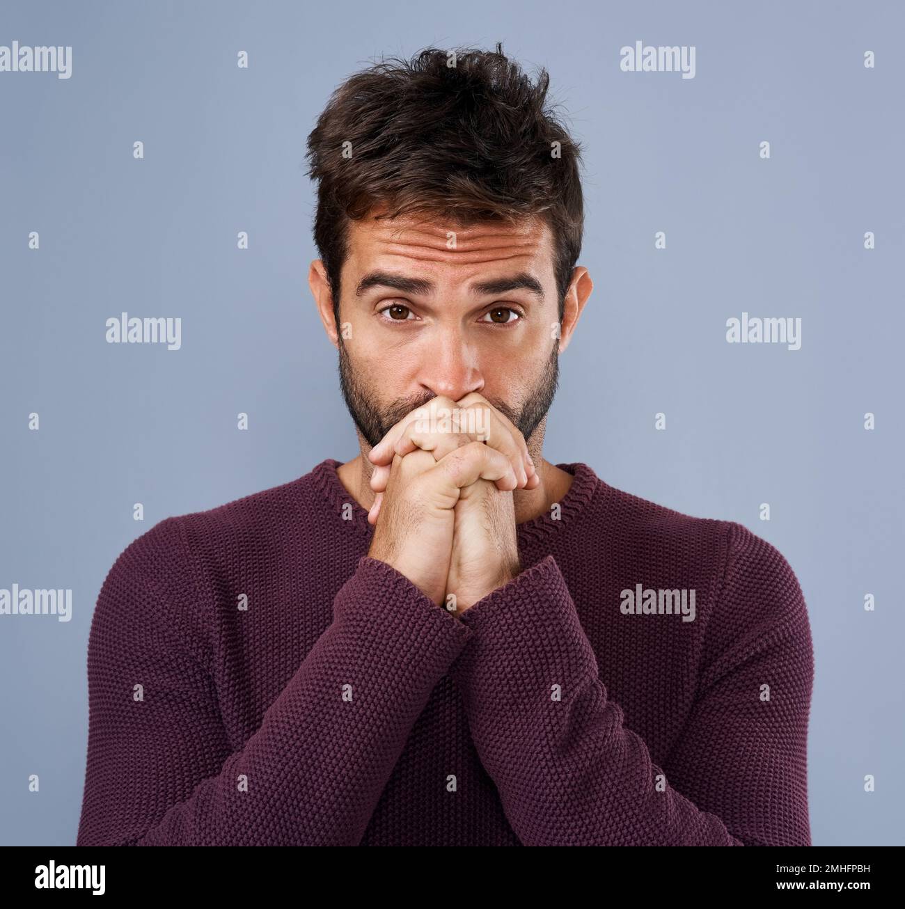 Putting the power of prayer in a challenge. Studio shot of a handsome ...