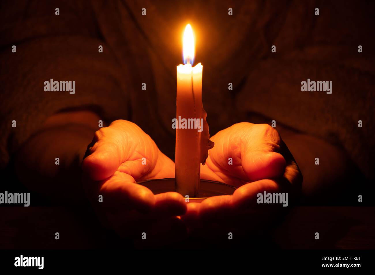 old woman's hands and candle flame in the dark, candle light, mourning, candle in the dark Stock ...
