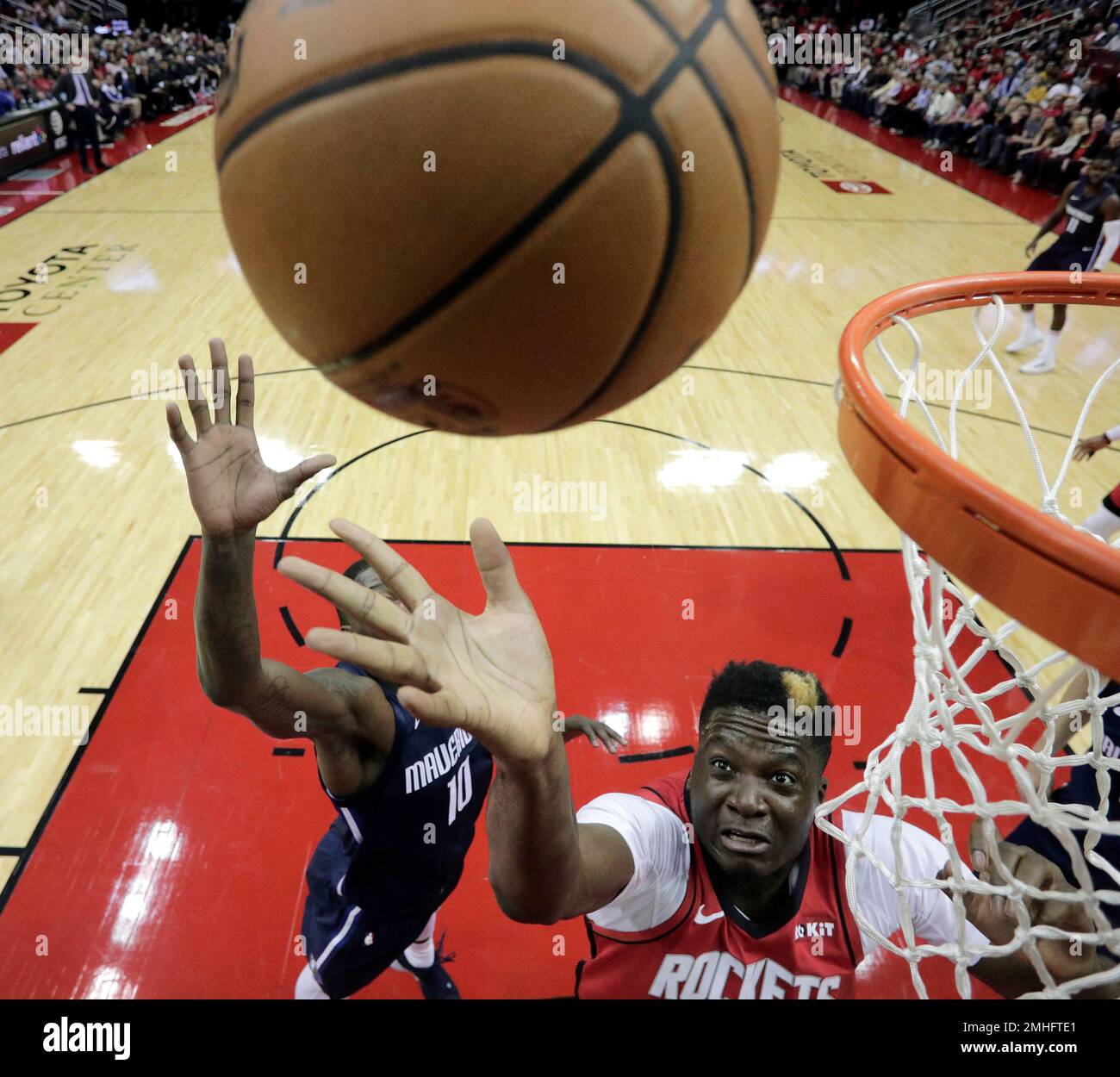 Houston Rockets' Clint Capela, right, shoots as Dallas Mavericks ...