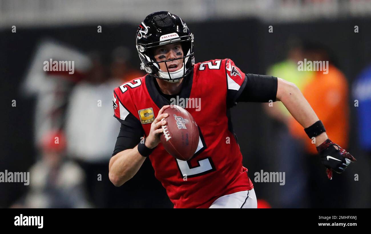 Atlanta Falcons quarterback Matt Ryan (2) runs out of the pocket ...
