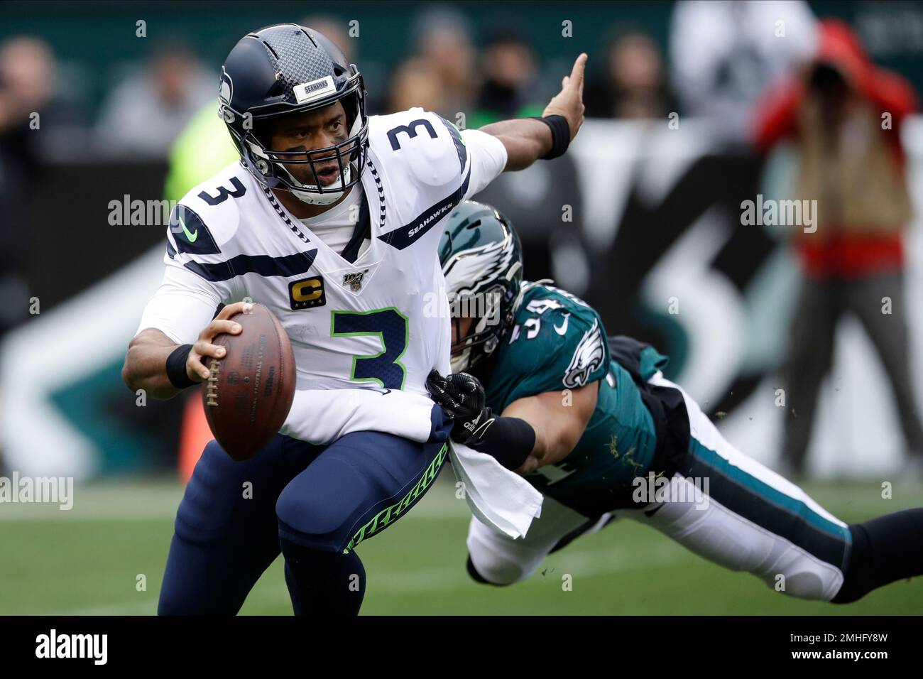 Seattle Seahawks' Russell Wilson (3) tries to slip past Philadelphia ...