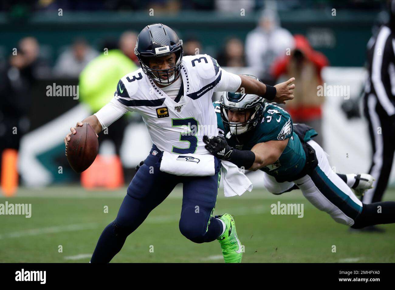 Seattle Seahawks' Russell Wilson (3) tries to slip past Philadelphia ...