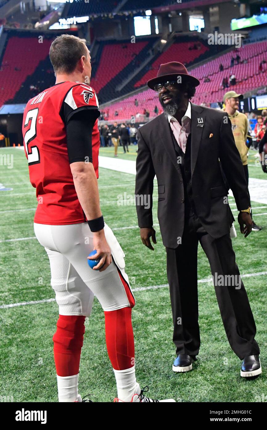 Atlanta Falcons quarterback Matt Ryan (2) speaks with former NFL player ...