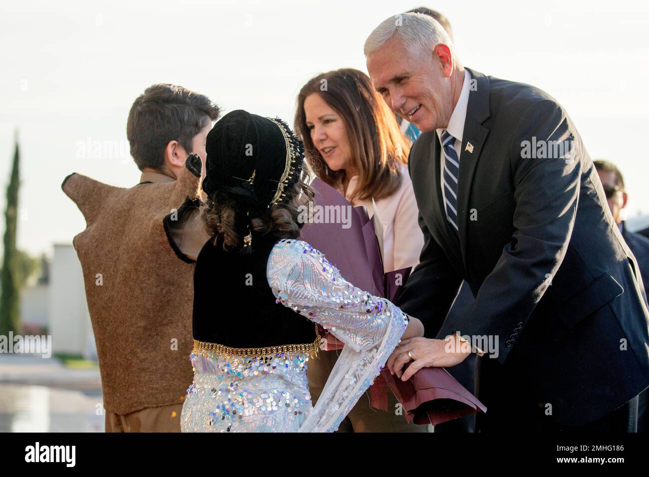 Children greet Vice President Mike Pence and his wife Karen Pence with ...