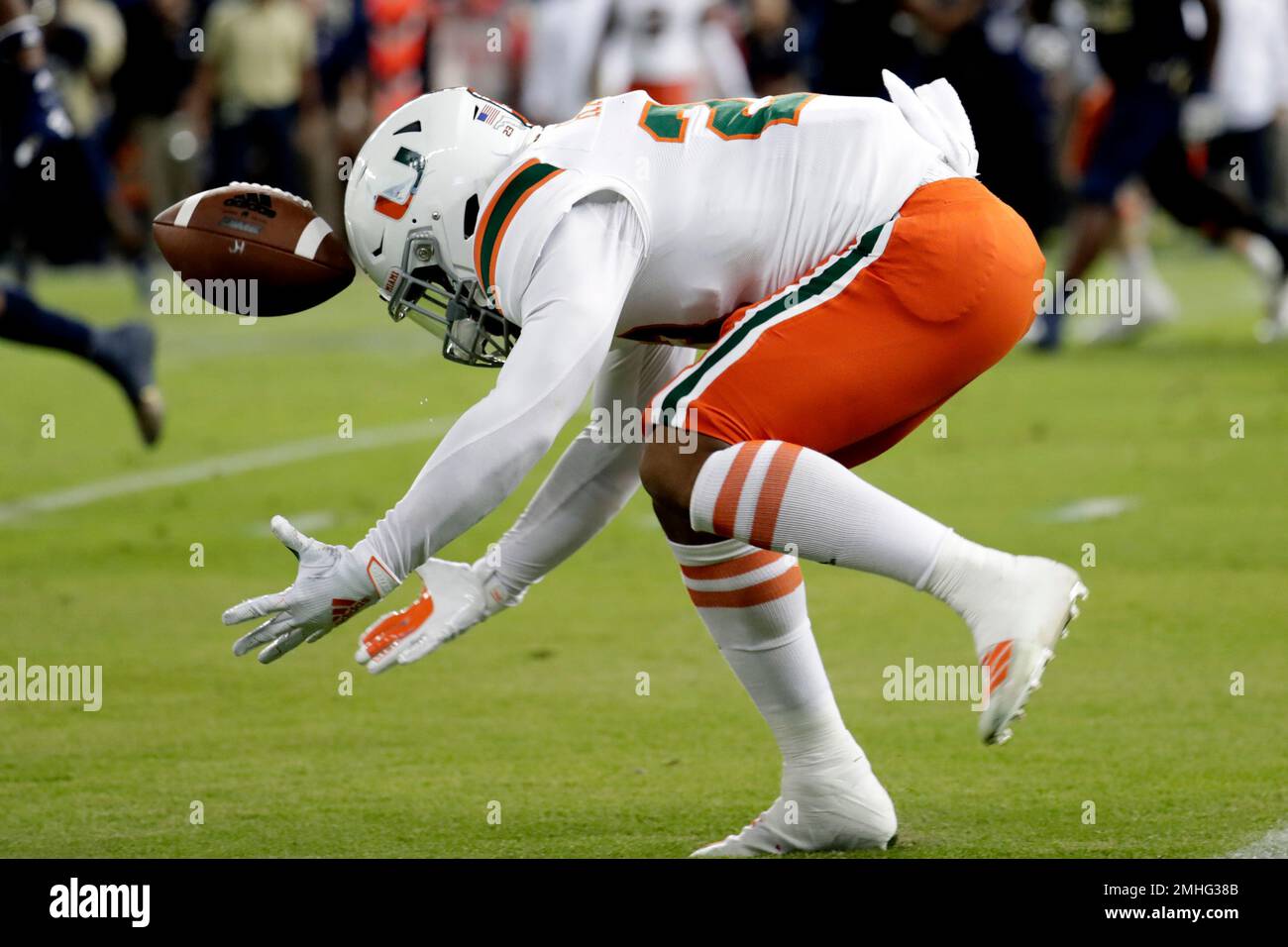 Miami running back Cam'Ron Harris cannot hold onto the football during ...