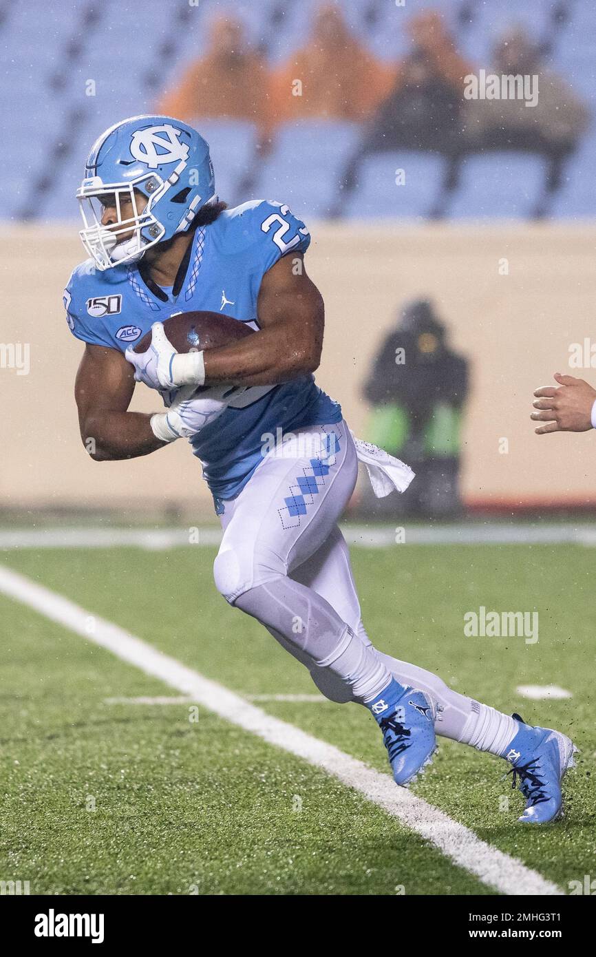 North Carolina's Josh Henderson (23) carries the ball during an NCAA ...