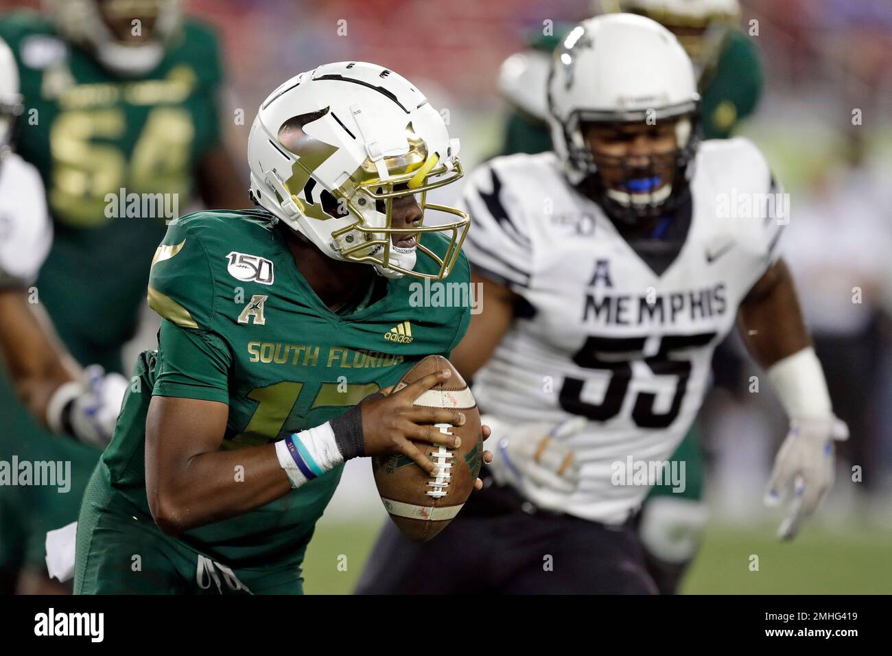 South Florida quarterback Jordan McCloud (12) scrambles away from ...