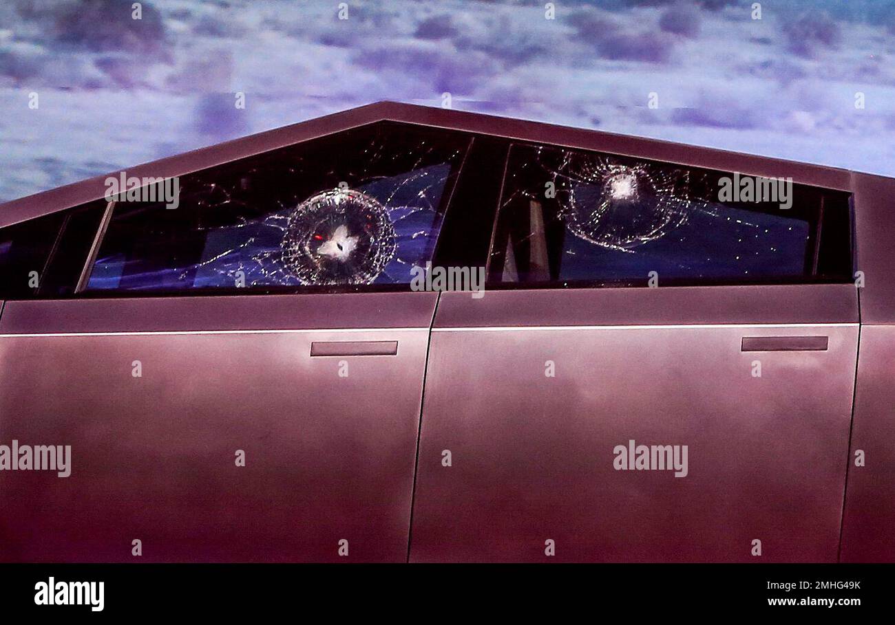The Cybertruck with broken window glass is displayed after Tesla CEO ...