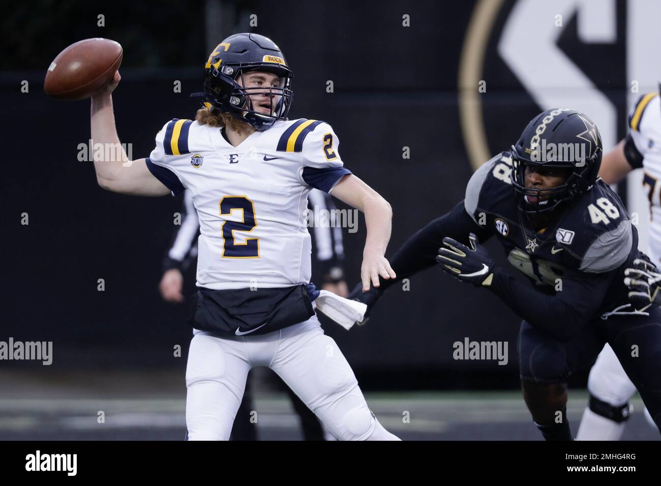 ETSU quarterback Tyler Riddell (2) passes as he is pressure by ...