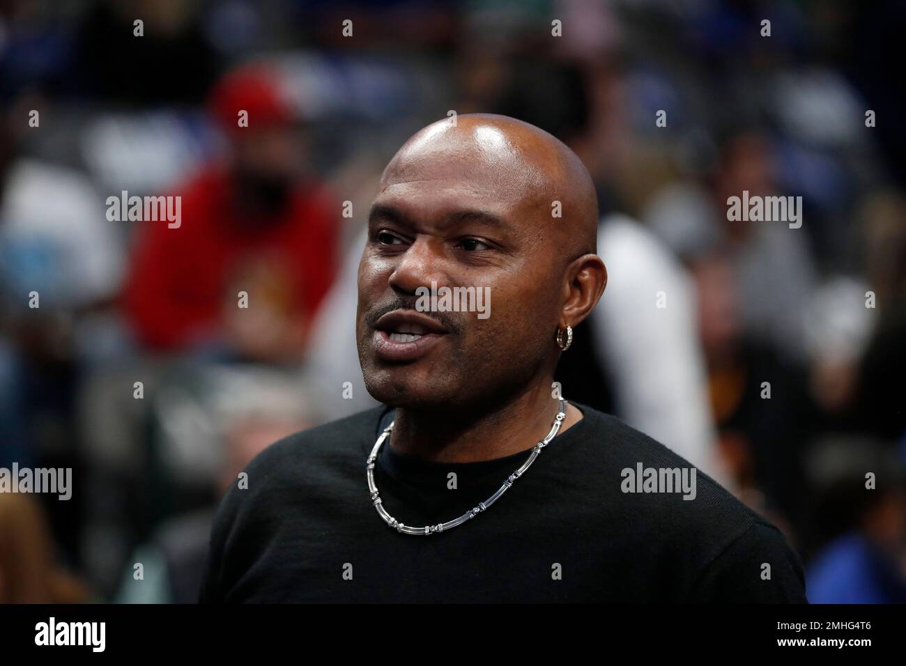 Former player Tim Hardaway attends an NBA basketball game between the ...