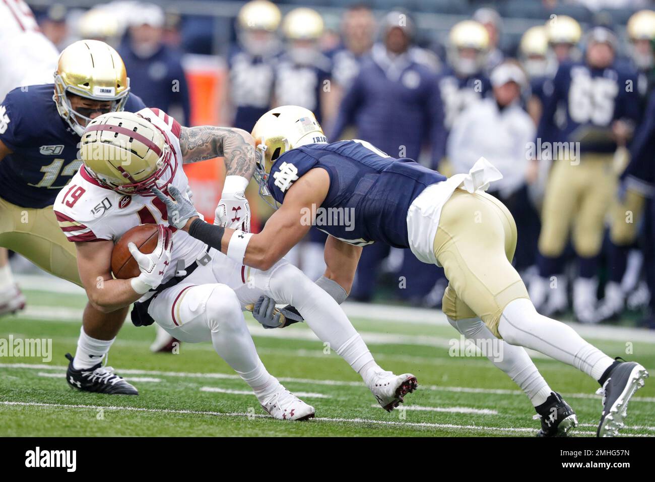 Boston College running back Ben Glines (19 is tackled by Notre Dame ...