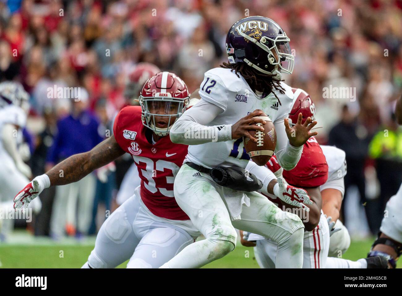 Western Carolina quarterback Tyrie Adams (12) runs from Alabama ...