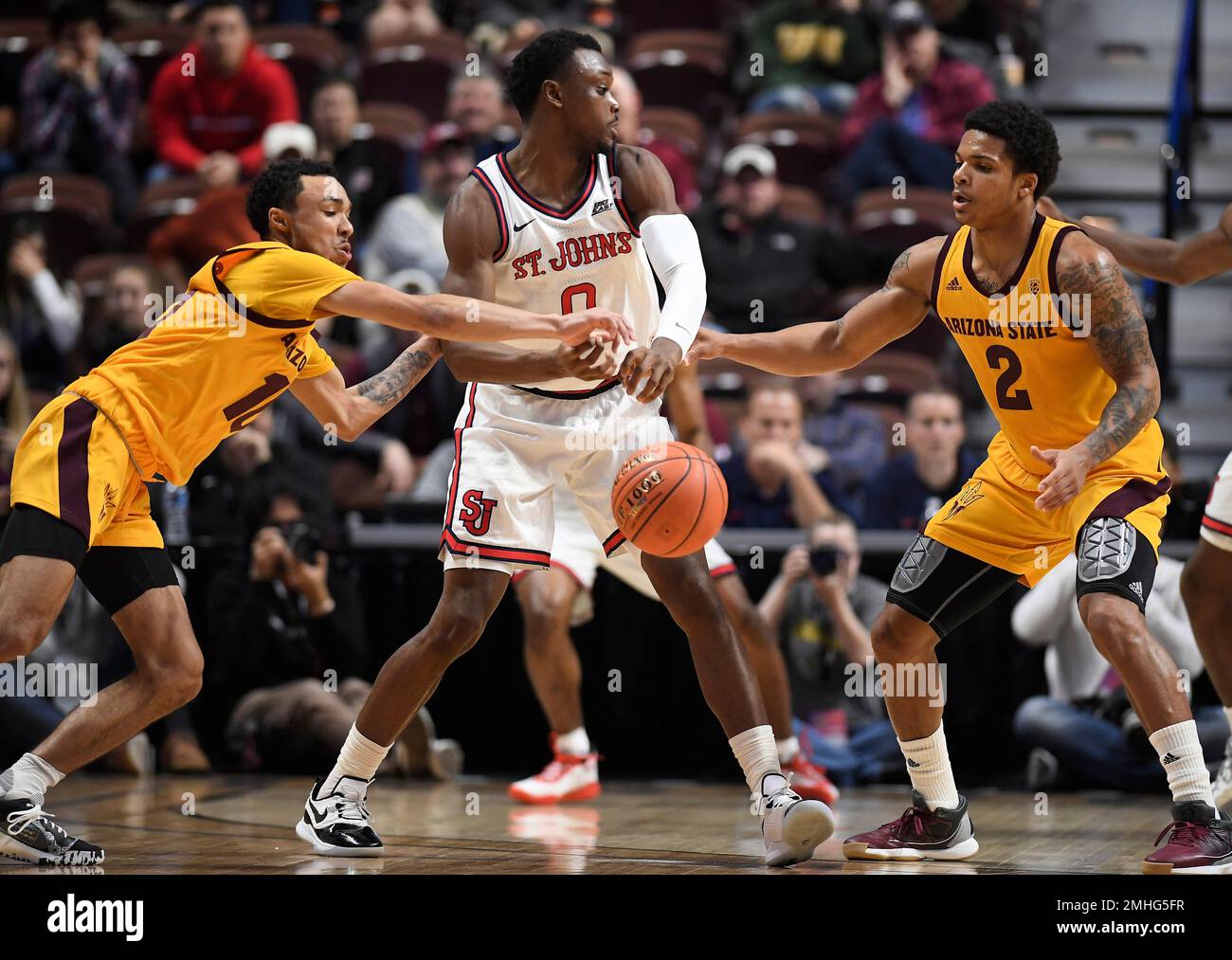 Arizona State's Jaelen House, left, knocks the ball from St. John's ...