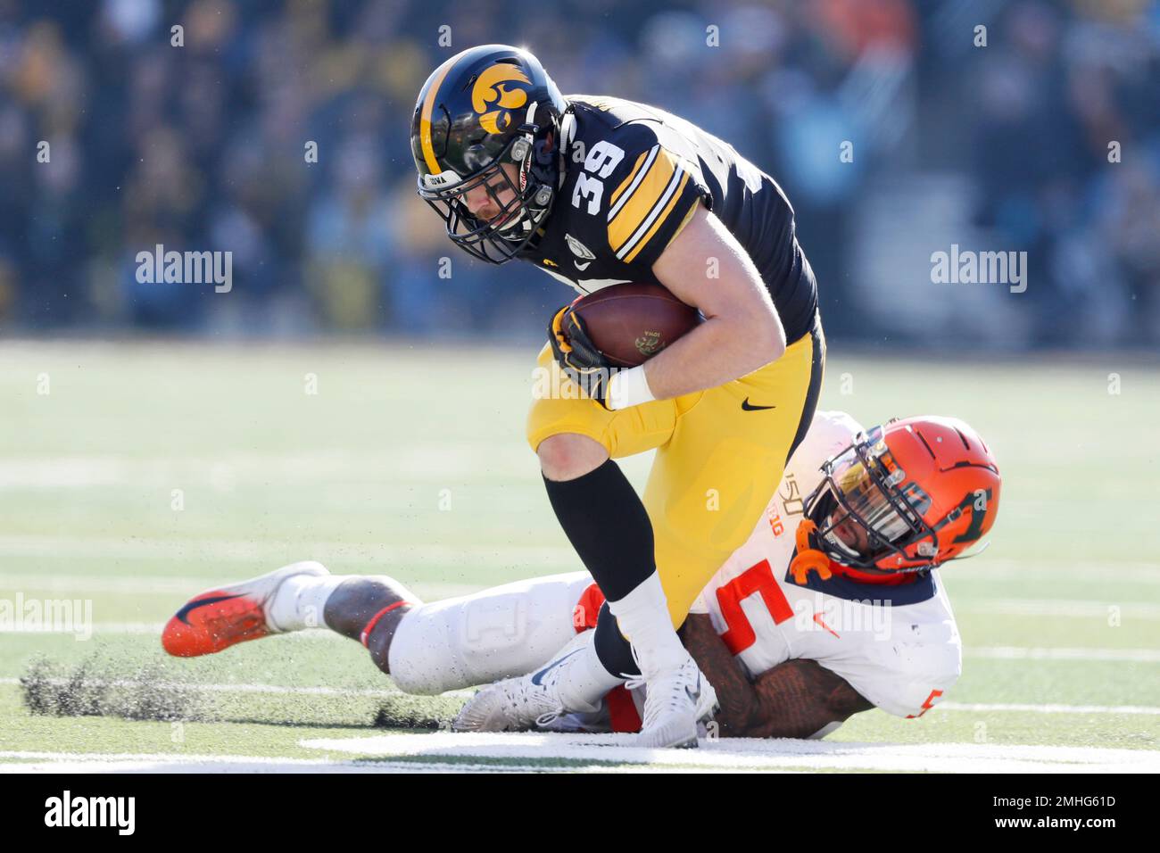 Iowa tight end Nate Wieting (39) breaks a tackle by Illinois linebacker ...