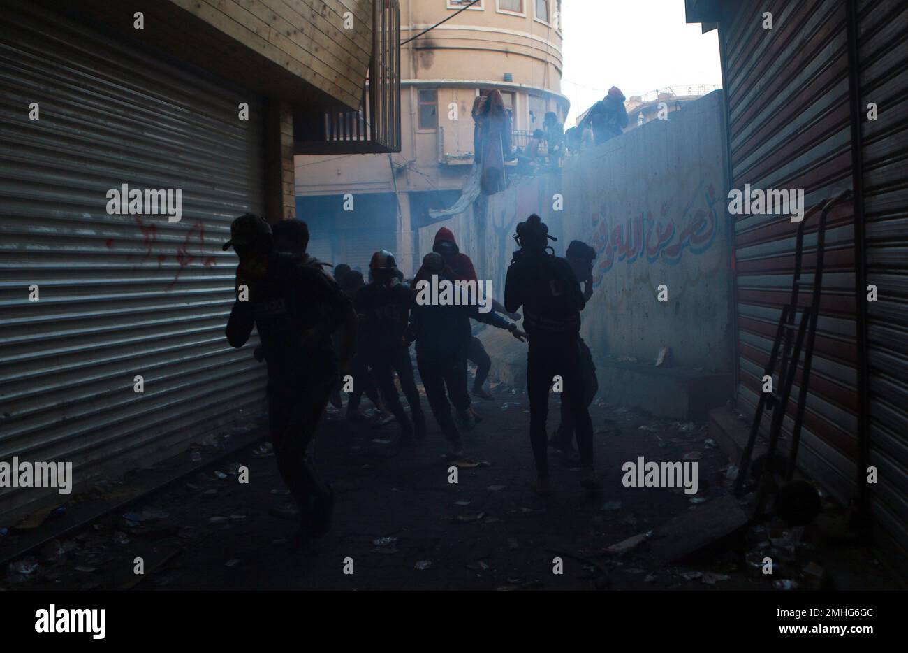 Riot police fire tear gas during clashes with anti-government ...