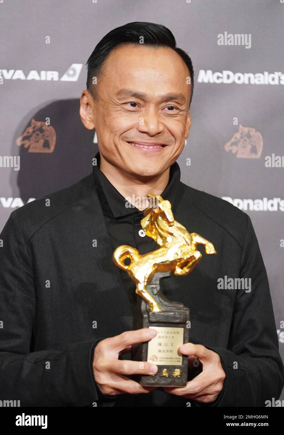 Taiwanese actor Chen Yi-wen holds his award for Best Leading Actor at the 56th Golden Horse ...