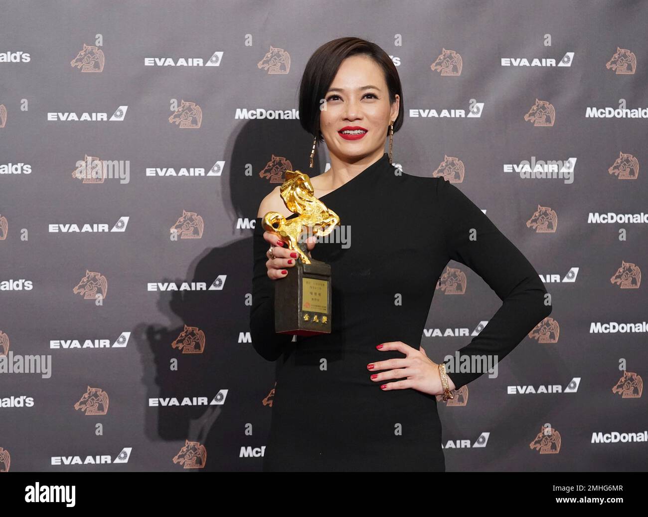 Malaysian actress Yeo Yann-yann holds her award for Best Leading Actress at the 56th Golden ...