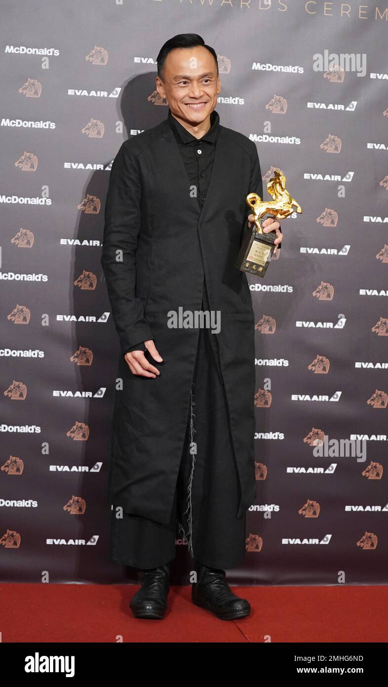 Taiwanese actor Chen Yi-wen holds his award for Best Leading Actor at ...