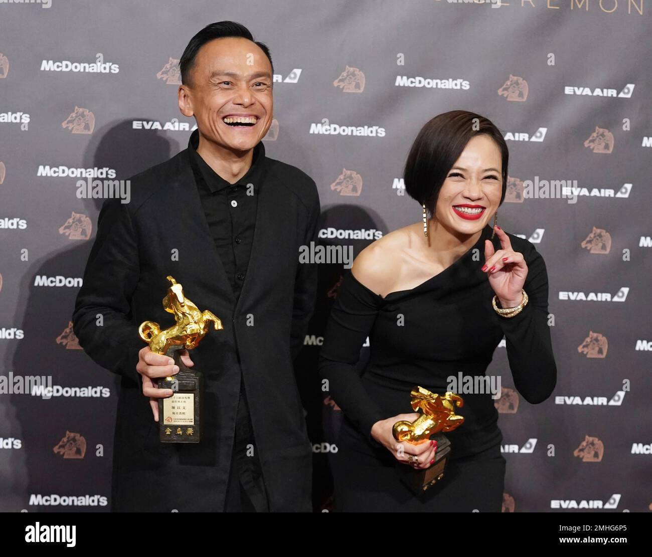 Malaysian actress Yeo Yann-yann, right, and Taiwanese actor Chen Yi-wen hold their awards for ...