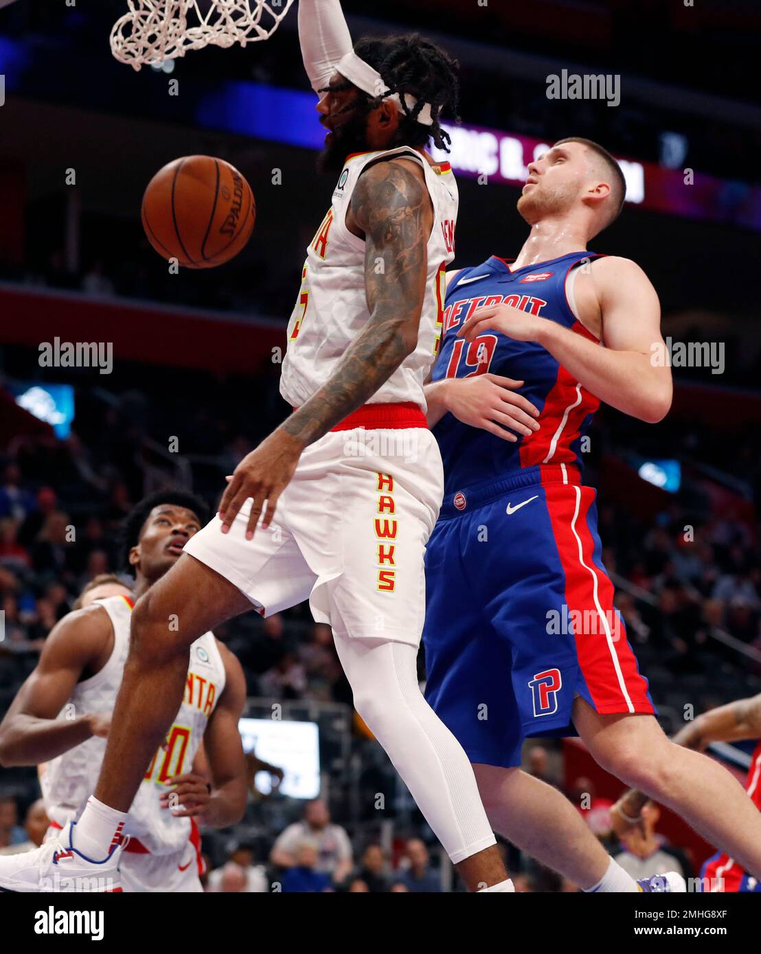 Atlanta Hawks guard DeAndre' Bembry (95) dunks next to Detroit Pistons ...