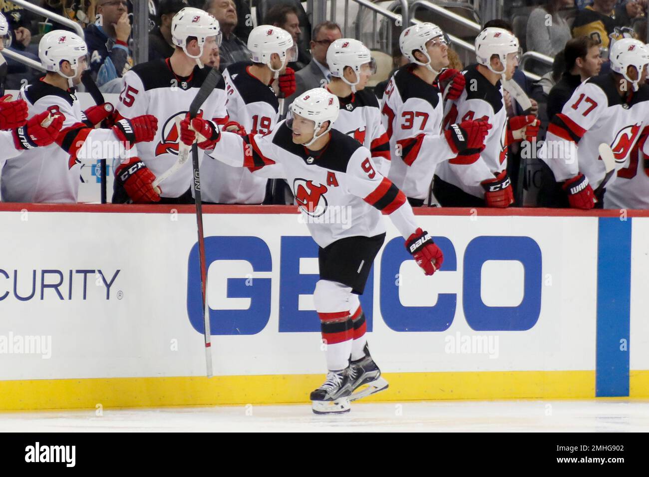 New Jersey Devils' Taylor Hall celebrates with teammates on the bench ...