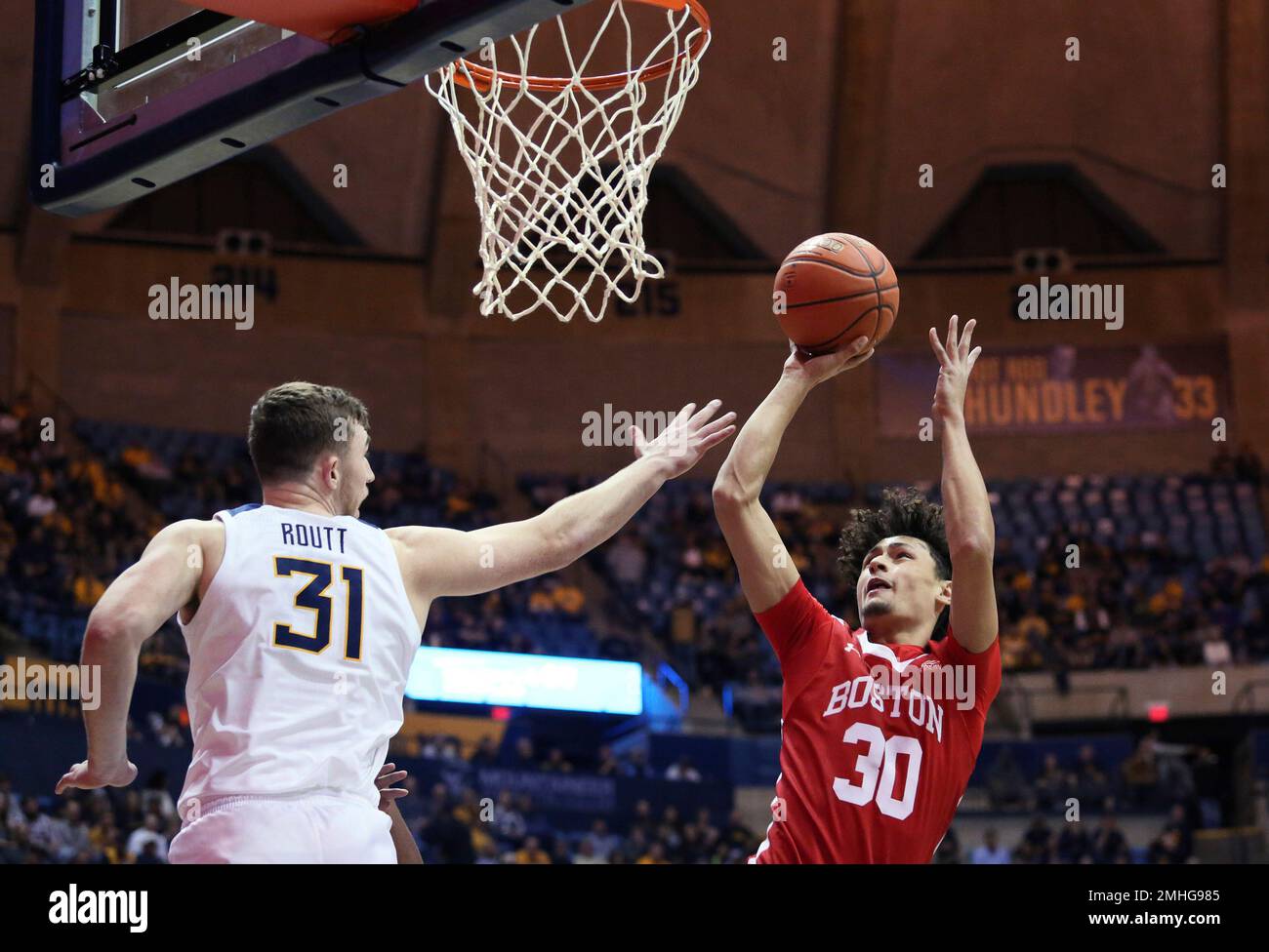 West Virginia forward Logan Routt (31) defends against Boston ...