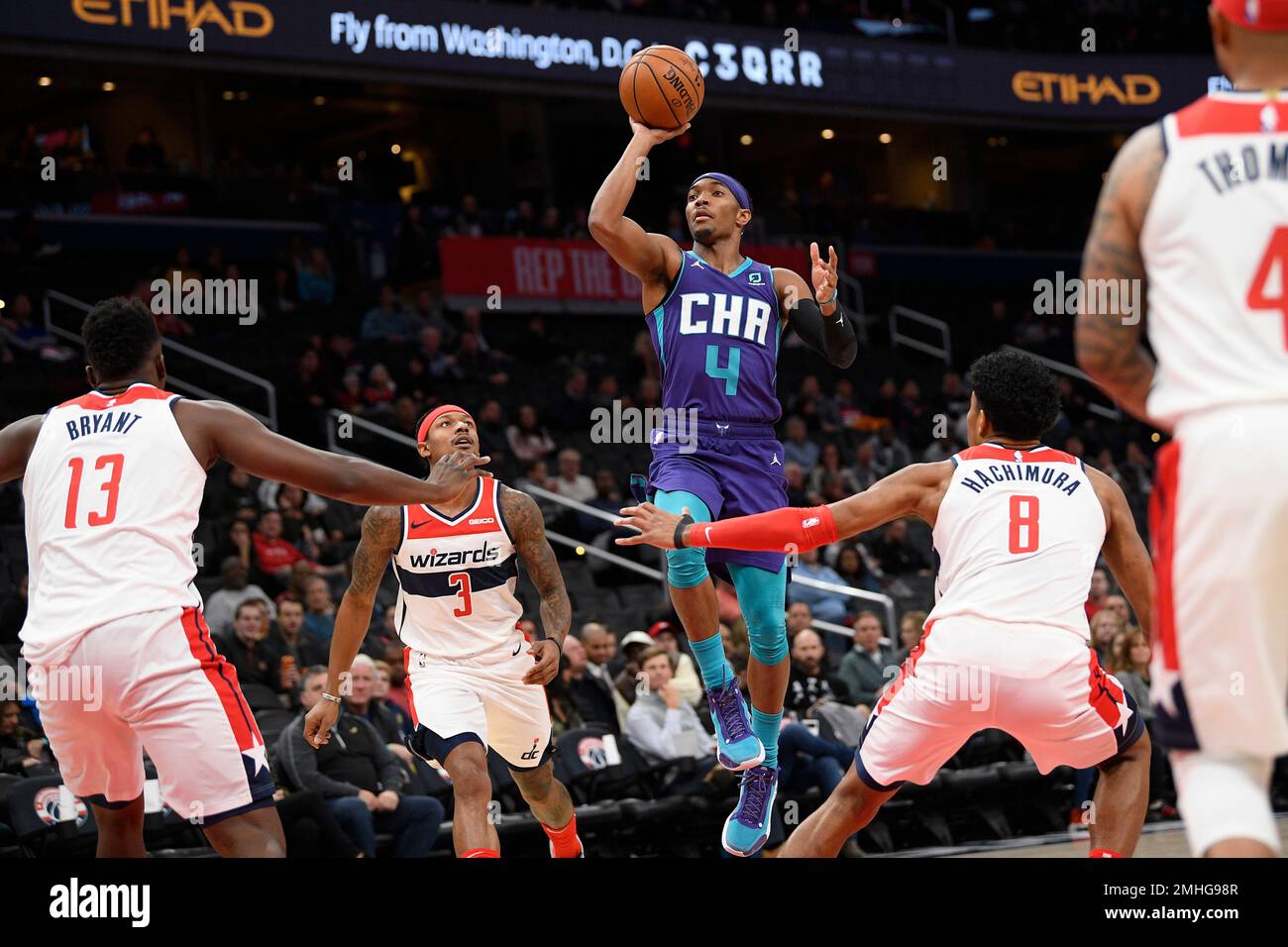 Charlotte Hornets guard Devonte' Graham (4) takes a shot as Washington ...